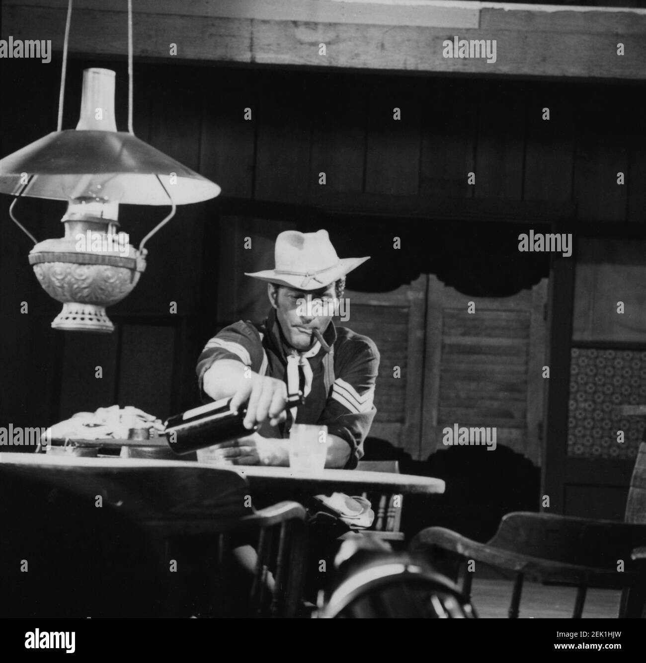 DEAN MARTIN on set candid smoking cigar and drinking whiskey during ...