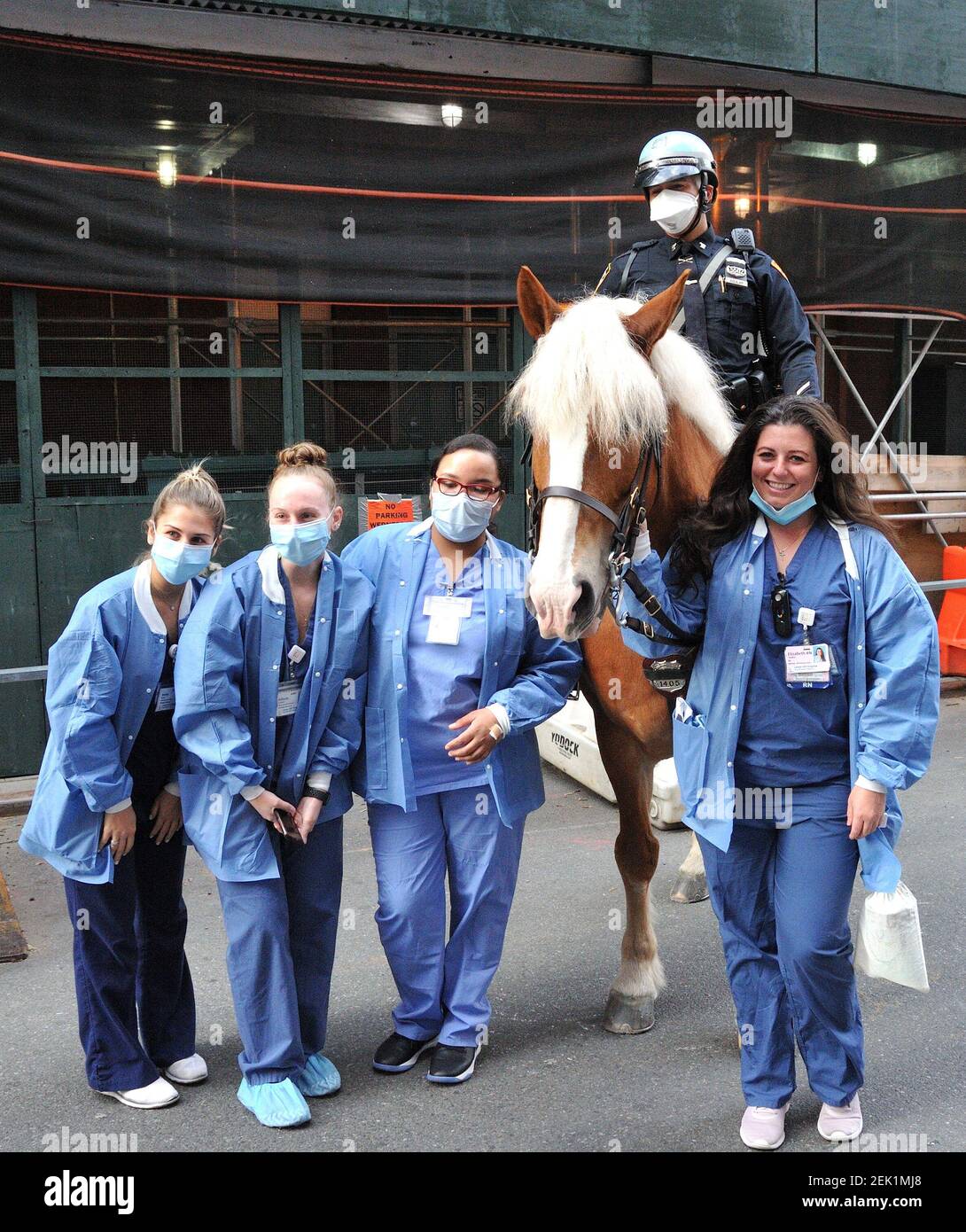 NYPD mounted patrol officer with hospital staff outside Lenox Hill ...