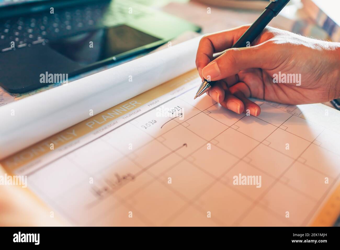 Tourist hold pen and planning vacation with calendar and map. Travel ...