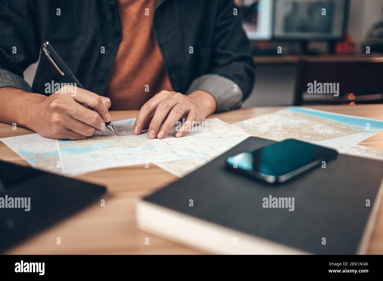 Tourist use pen for marking location and planing travel. Map, Coffee ...