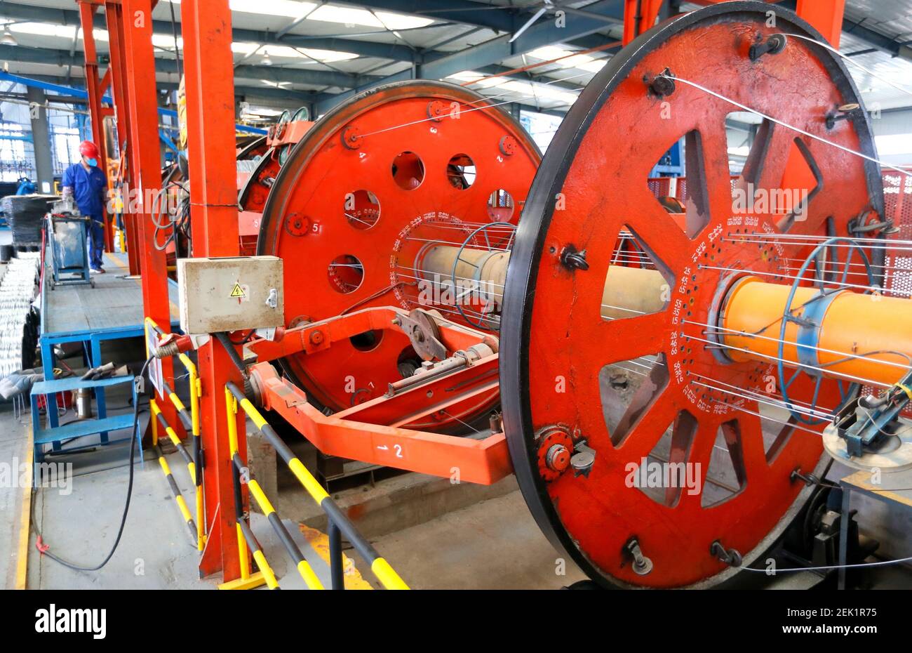 With the help of machines, workers produce submarine communication ...