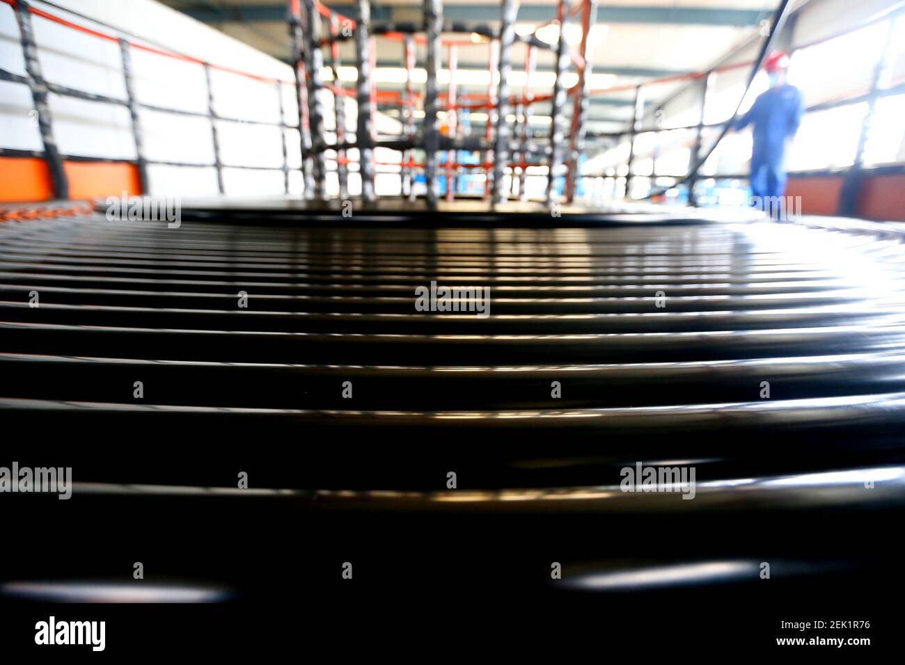 With the help of machines, workers produce submarine communication ...