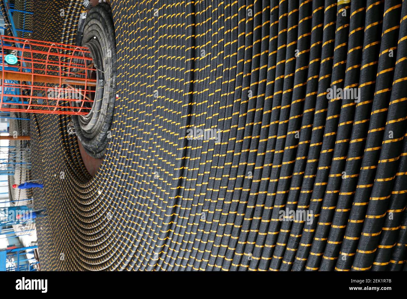With the help of machines, workers produce submarine communication ...