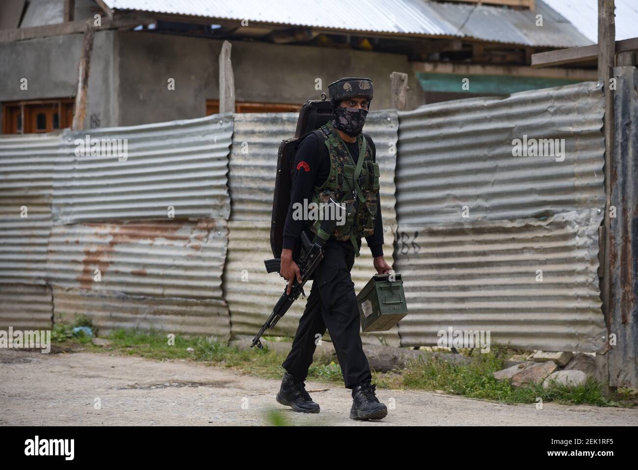 A paramilitary trooper wears a face mask as a preventive seen ...
