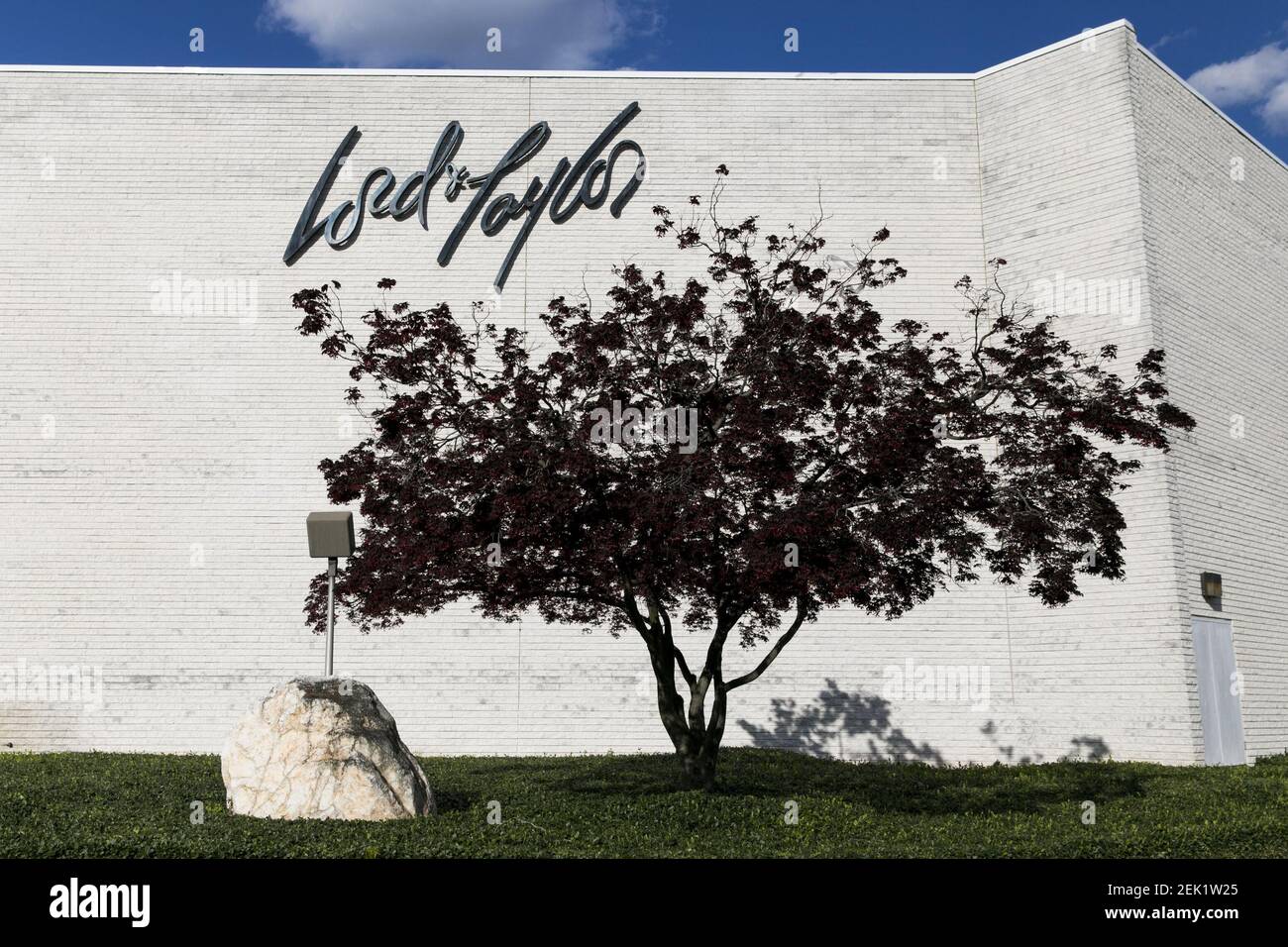 A logo sign outside of a Lord & Taylor department store location in ...