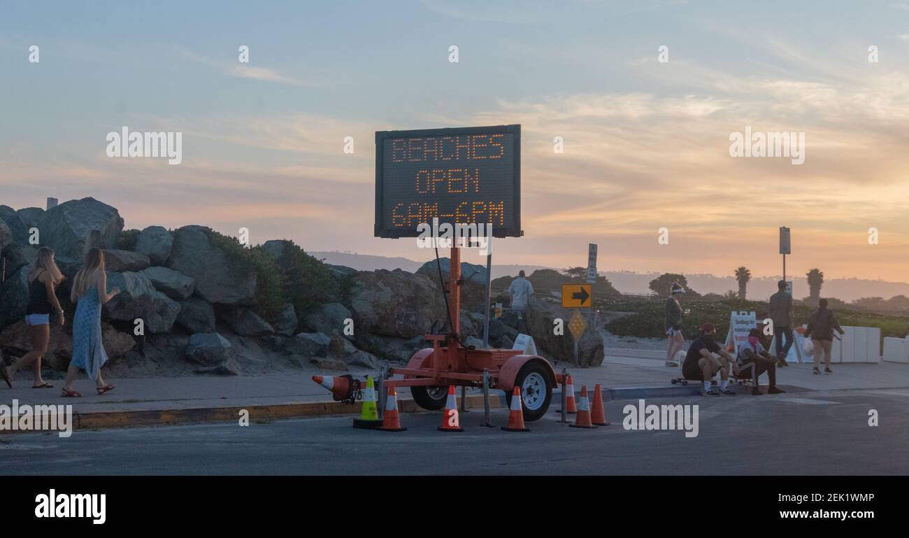 A sign displays Coronado Beach hours. San Diegans enjoyed Coronado ...