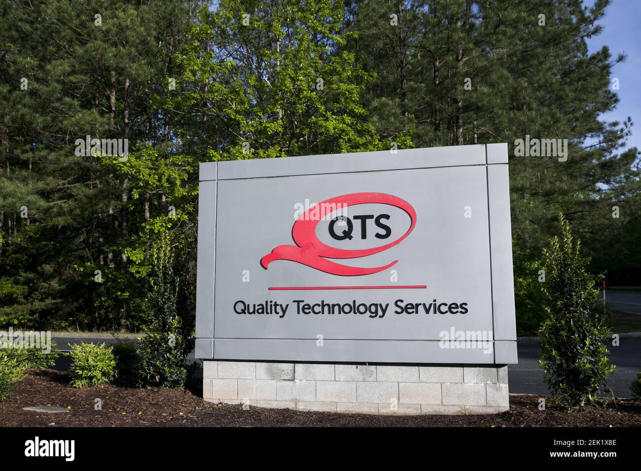 A logo sign outside of a Quality Technology Services (QTS) Data Center ...