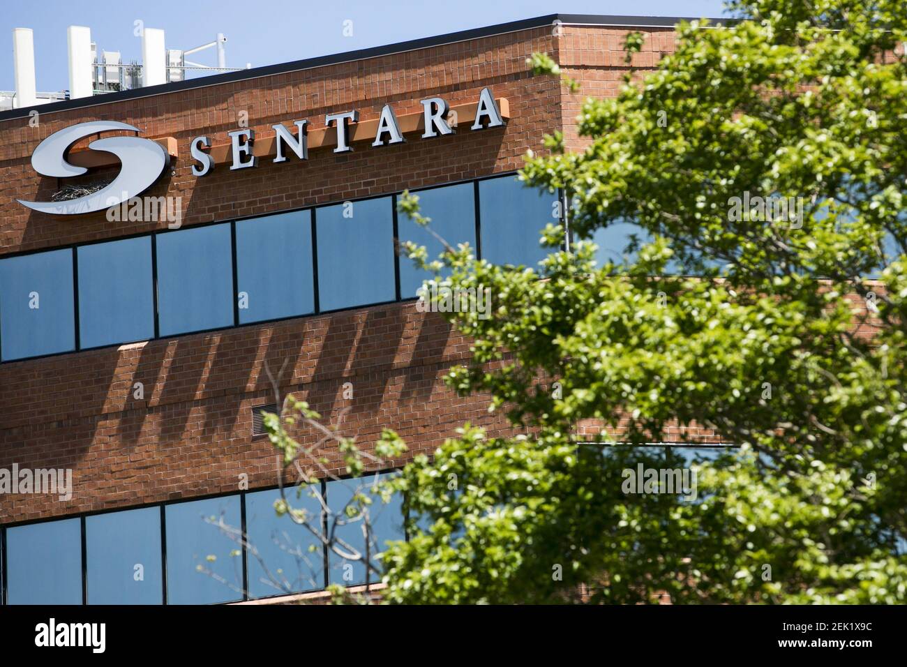 A logo sign outside of a facility occupied by Sentara Healthcare in ...