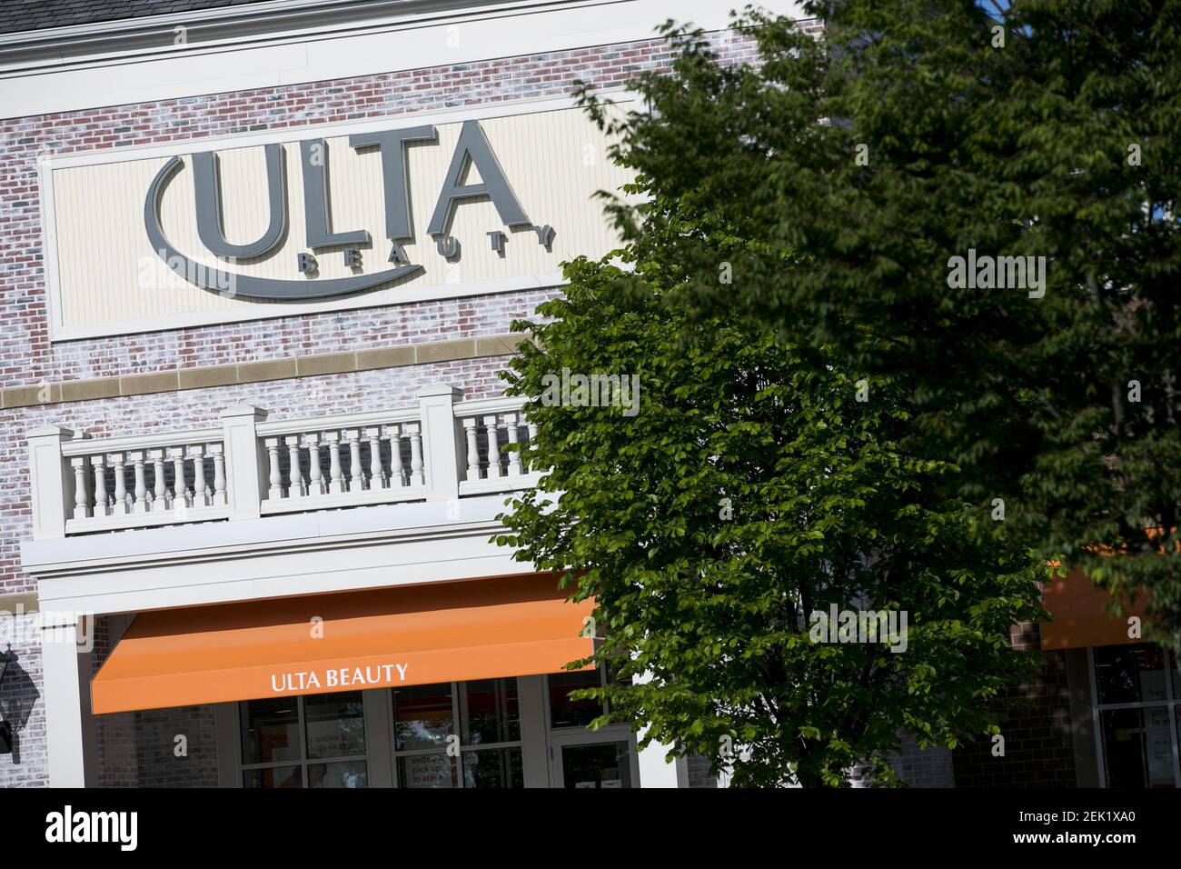 A logo sign outside of a Ulta Beauty retail store location in ...