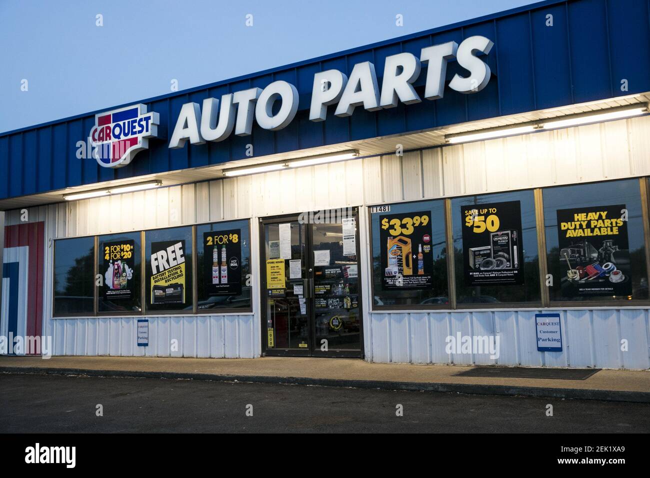 A logo sign outside of a Carquest Auto Parts retail store location in ...