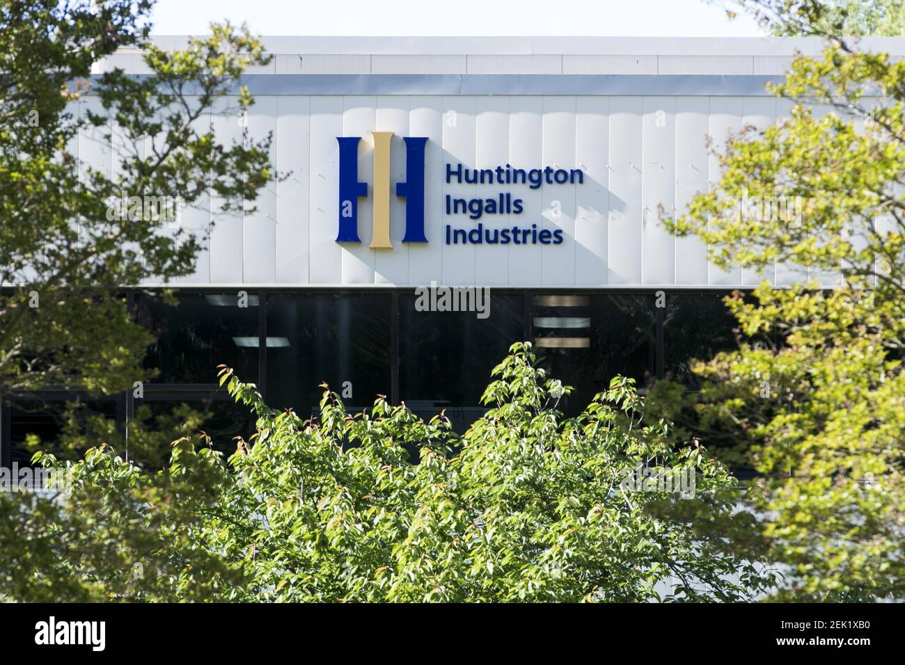 A logo sign outside of a facility occupied by Huntington Ingalls ...