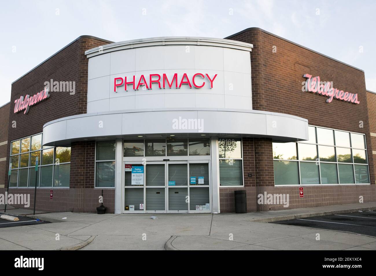 A logo sign outside of a Walgreens pharmacy location in Winchester ...