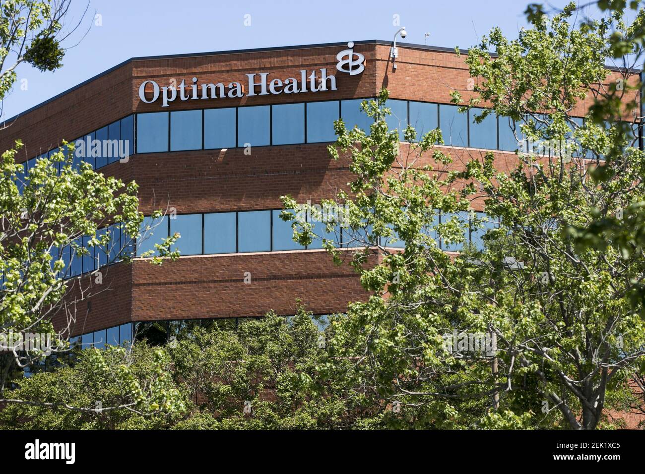 A logo sign outside of the headquarters of Optima Health in Virginia ...
