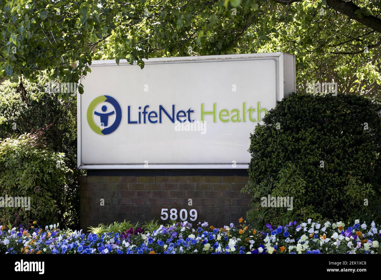 A logo sign outside of a facility occupied by LifeNet Health in ...