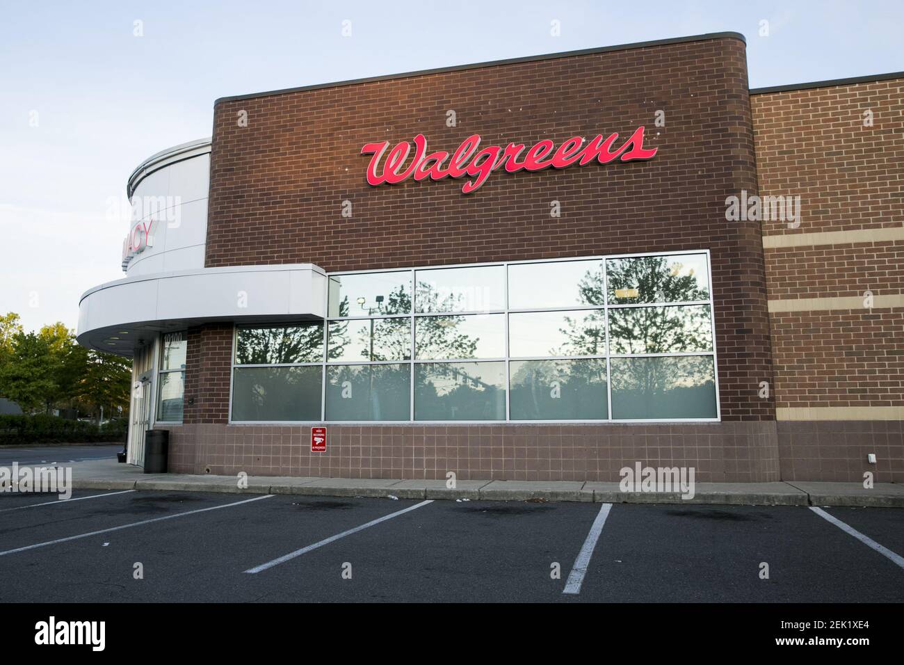 A logo sign outside of a Walgreens pharmacy location in Winchester ...
