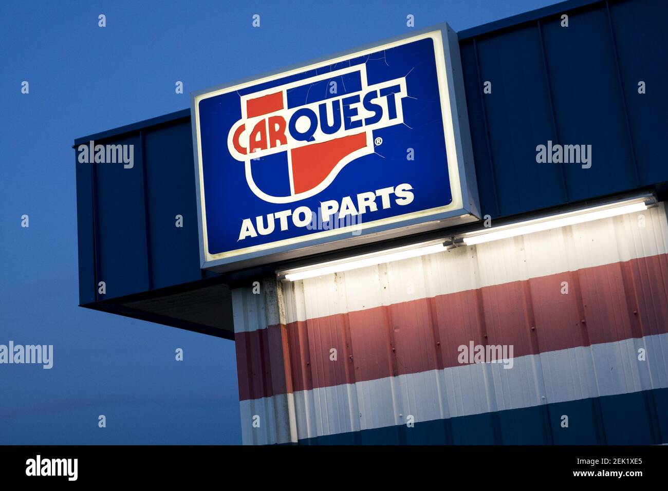 A logo sign outside of a Carquest Auto Parts retail store location in ...
