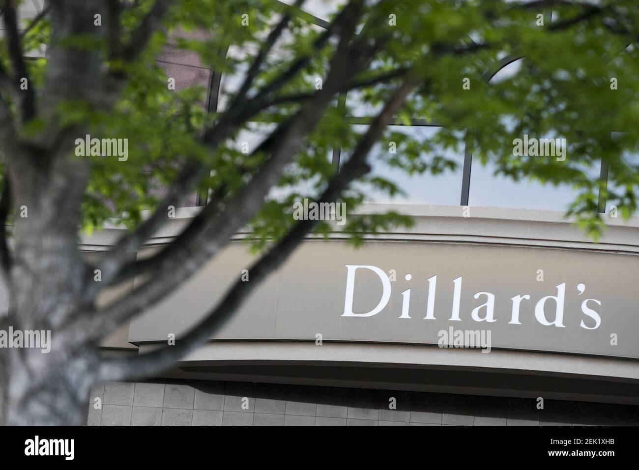 A logo sign outside of a Dillard's retail store location in Richmond ...