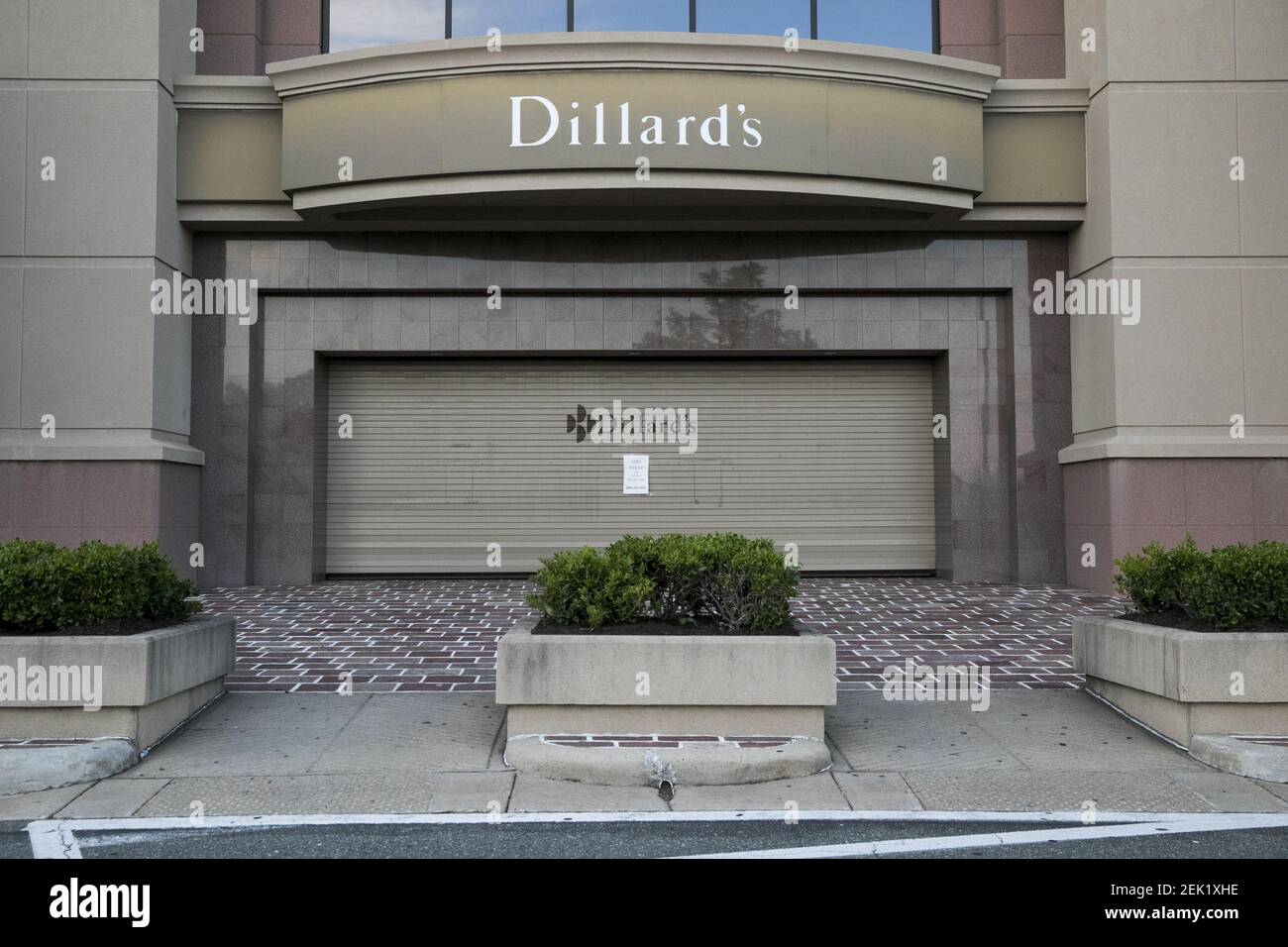 A logo sign outside of a Dillard's retail store location in Richmond ...
