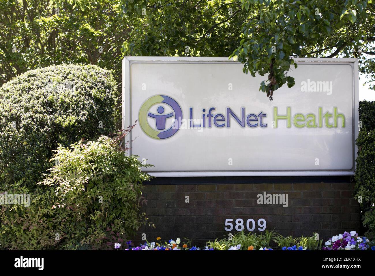 A logo sign outside of a facility occupied by LifeNet Health in ...