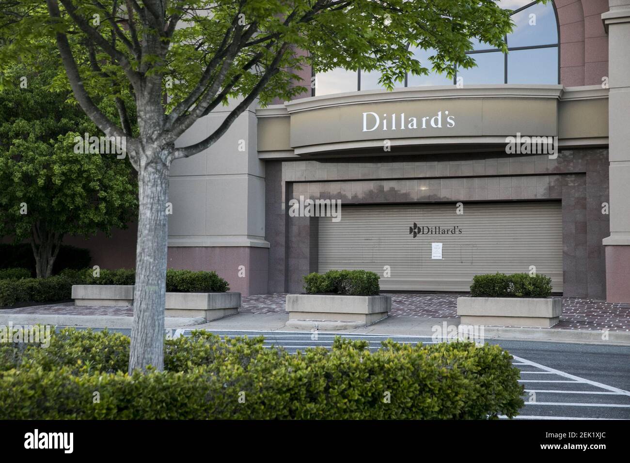 A logo sign outside of a Dillard's retail store location in Richmond ...