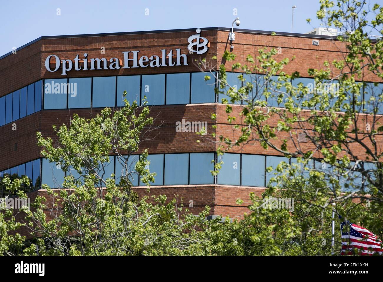A logo sign outside of the headquarters of Optima Health in Virginia ...