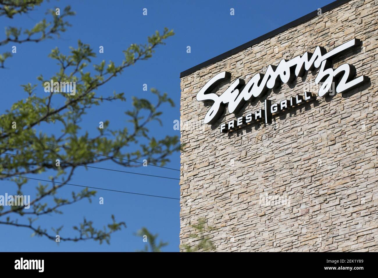 A logo sign outside of a Seasons 52 restaurant location in King of ...