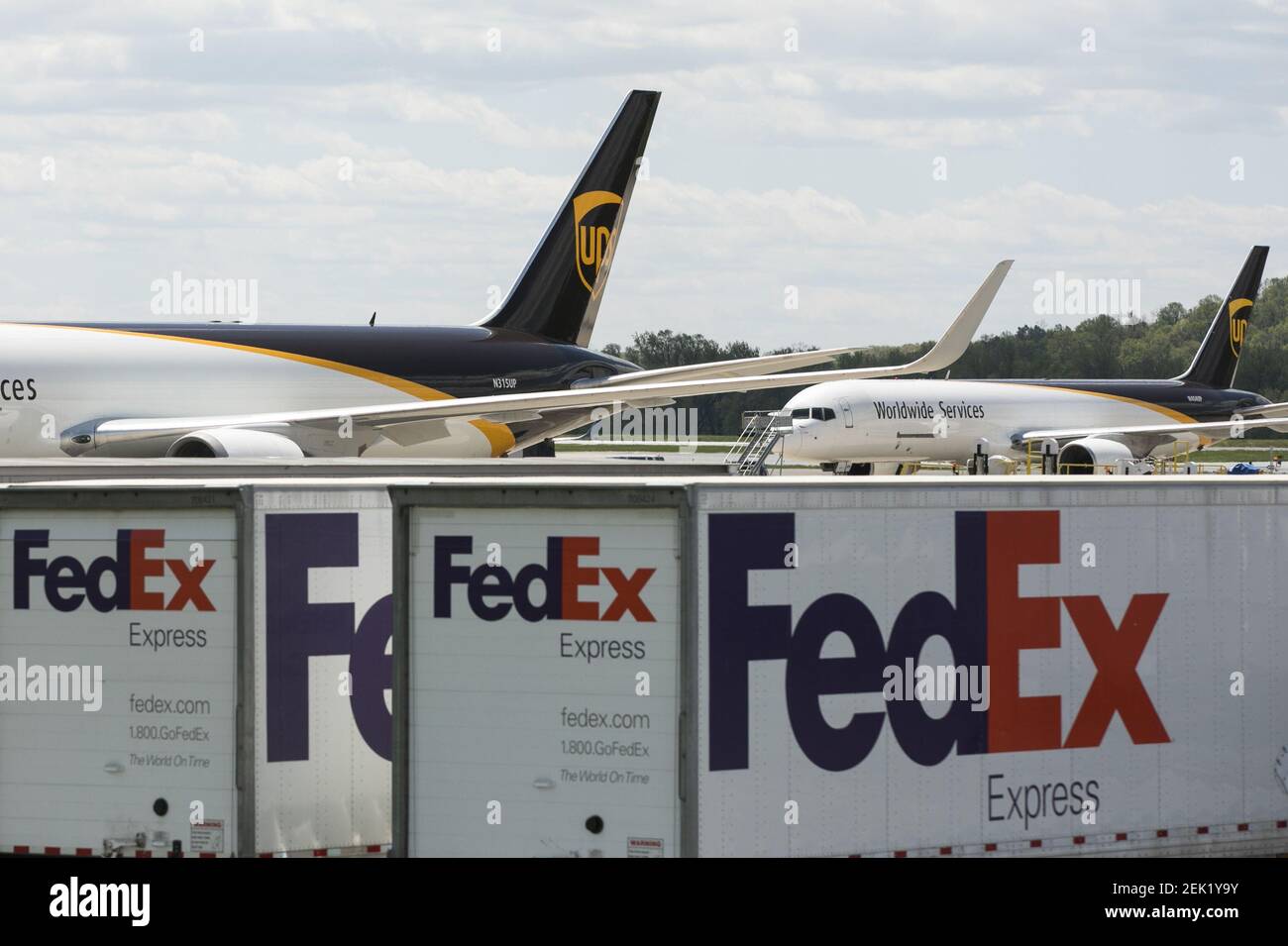 FedEx Express truck trailers are seen in-front of a United Parcel ...