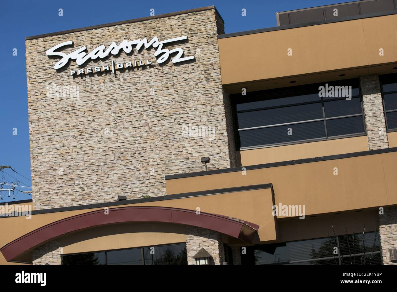 A logo sign outside of a Seasons 52 restaurant location in King of ...