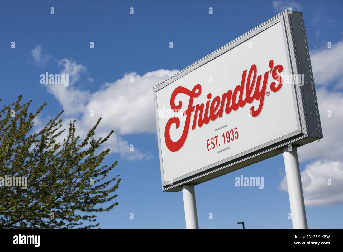A logo sign outside of a Friendly's restaurant location in Hershey ...