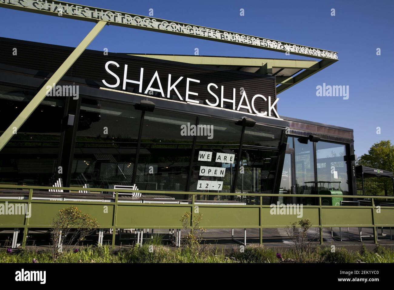 A logo sign outside of a Shake Shack restaurant location in King of ...