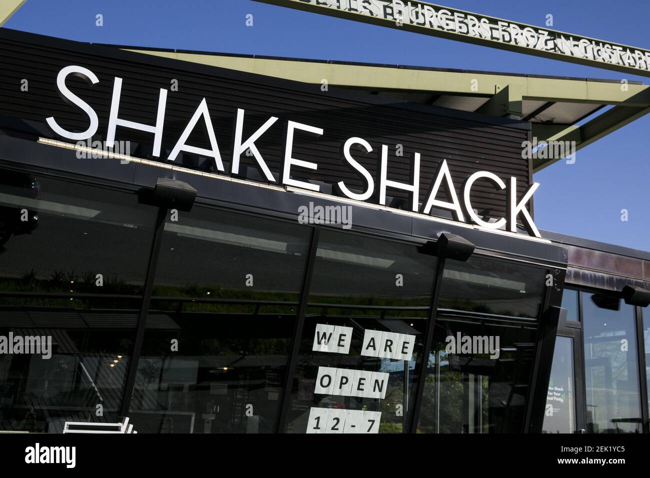 A logo sign outside of a Shake Shack restaurant location in King of ...