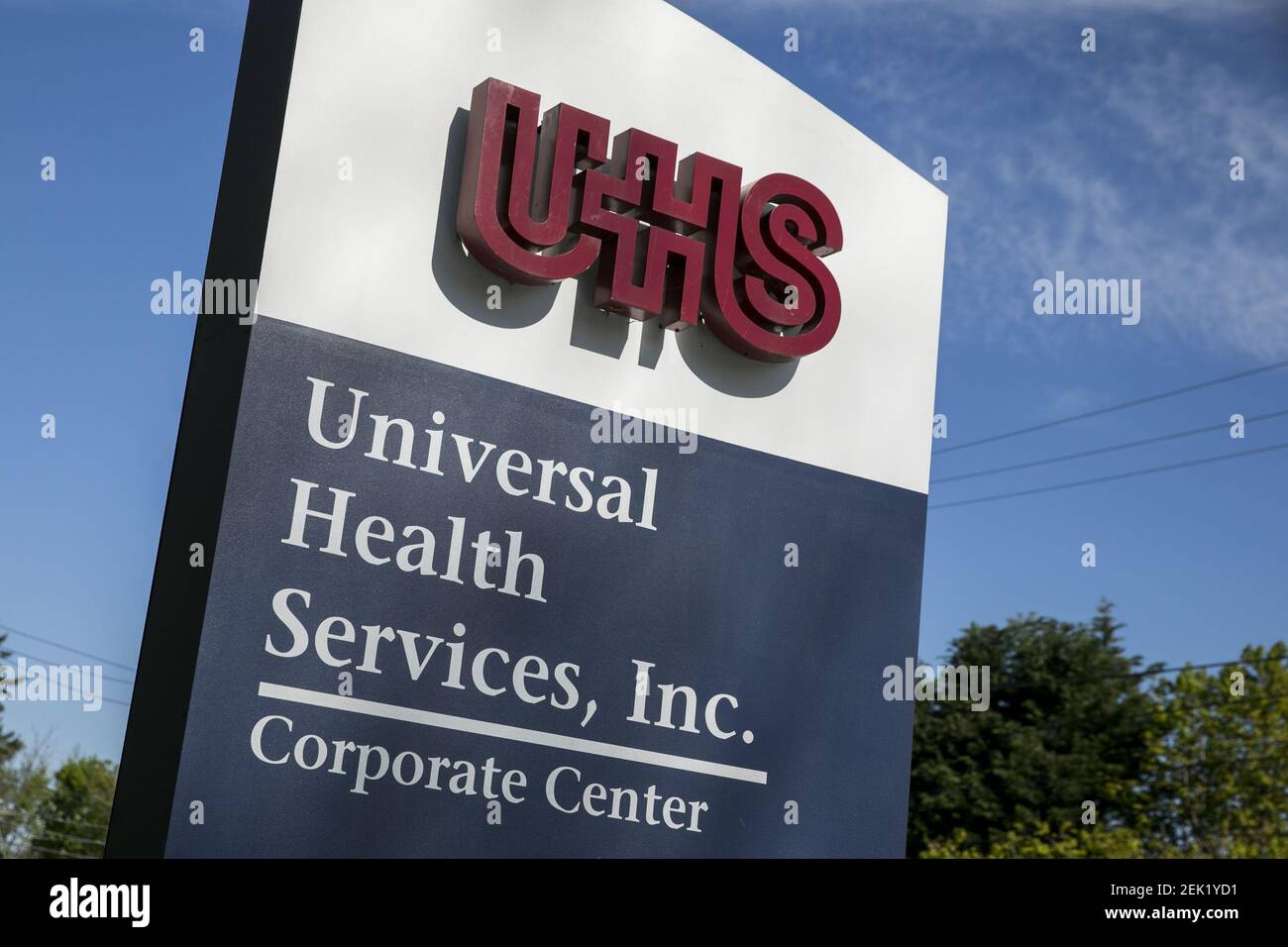 A logo sign outside of the headquarters of Universal Health Services ...