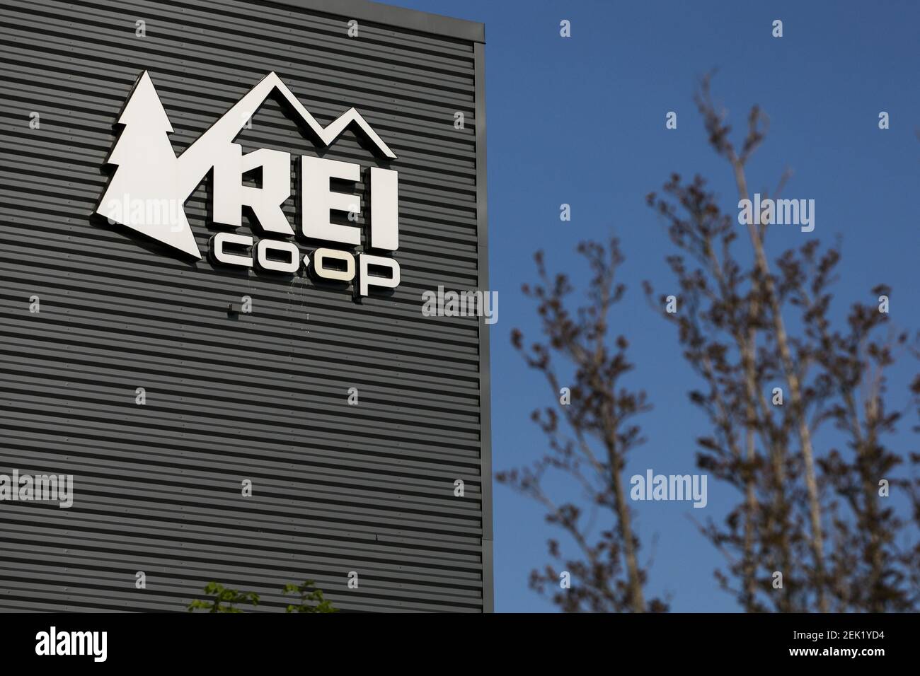A logo sign outside of a Recreational Equipment, Inc., (REI) retail ...