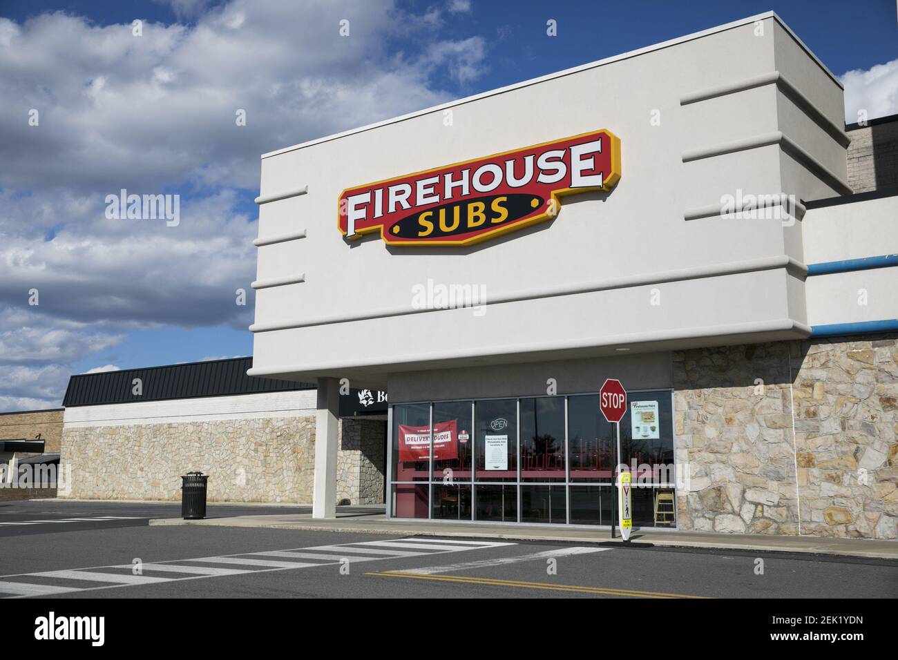 A logo sign outside of a Firehouse Subs restaurant location in ...