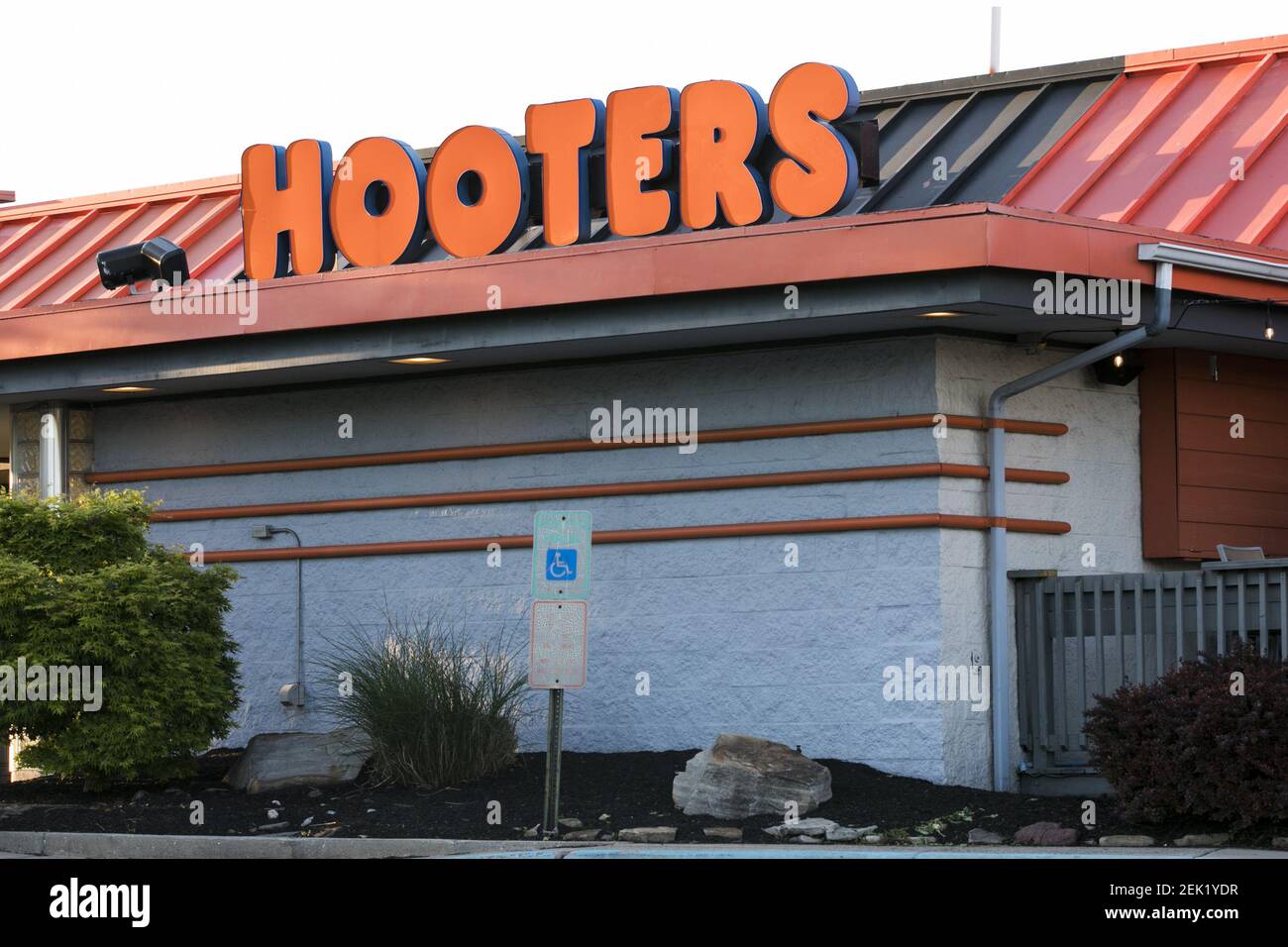 A logo sign outside of a Hooters restaurant location in King of Prussia ...