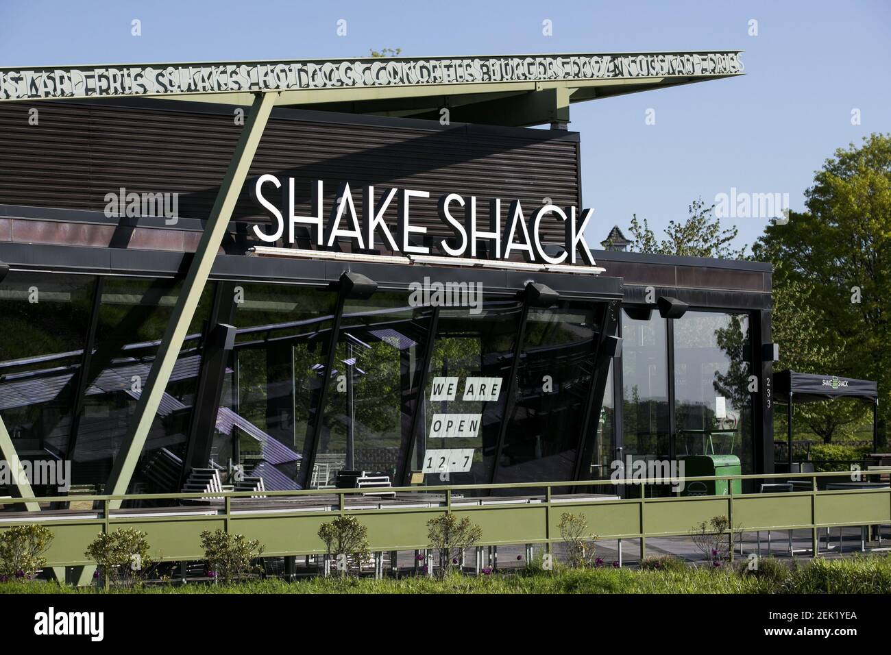 A logo sign outside of a Shake Shack restaurant location in King of ...