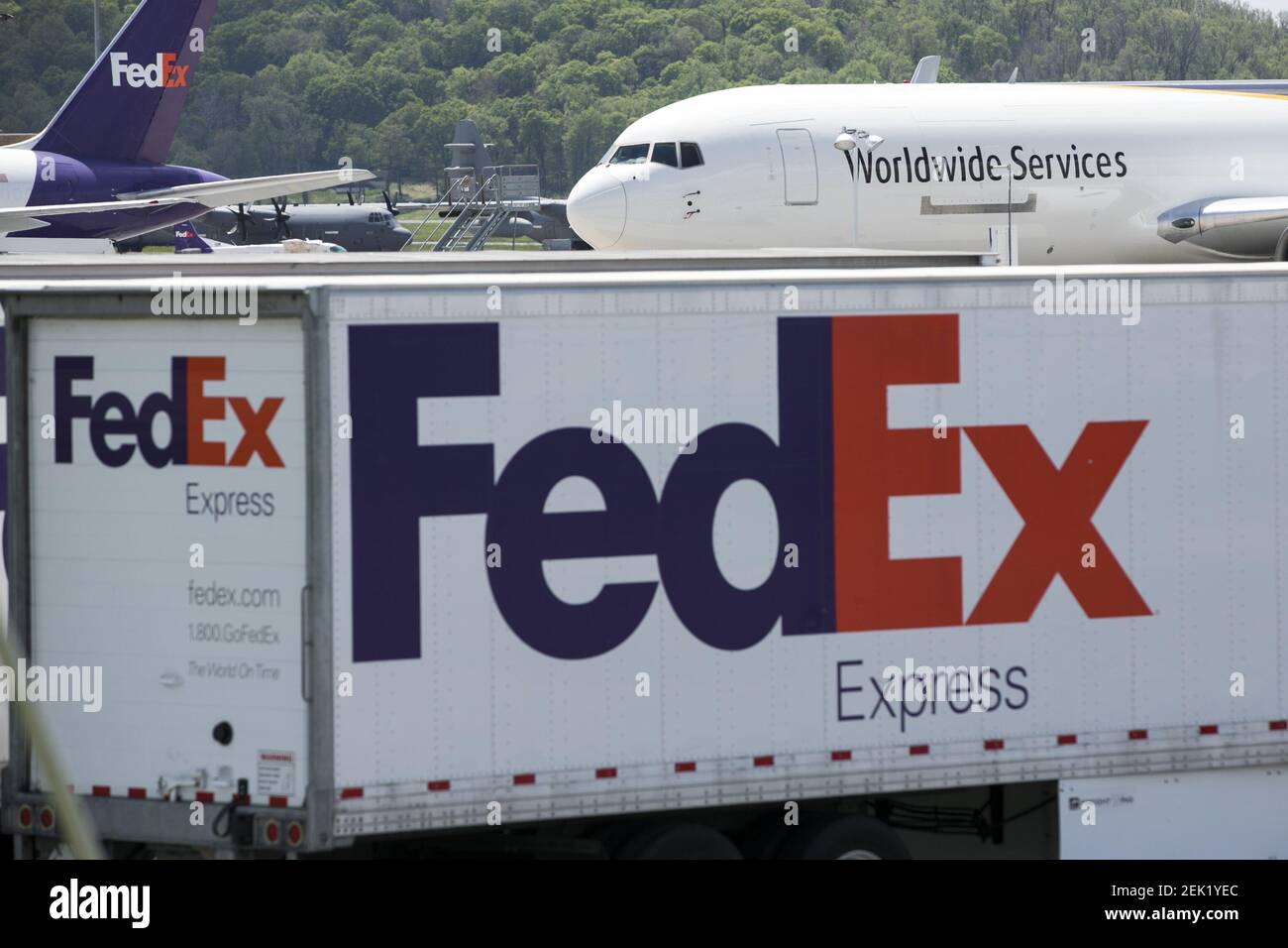 FedEx Express truck trailers are seen in-front of a United Parcel ...