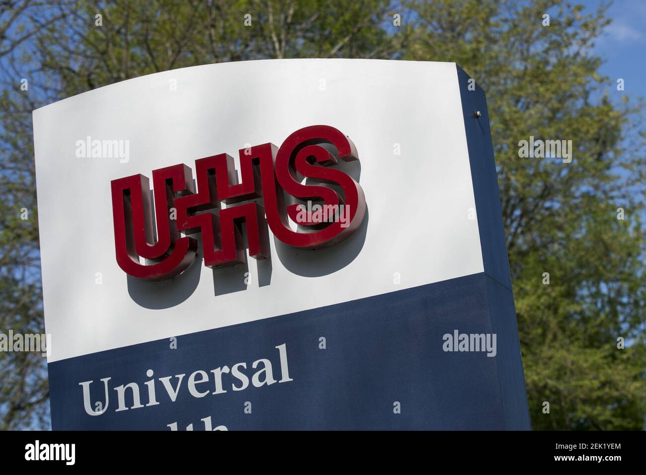 A logo sign outside of the headquarters of Universal Health Services ...