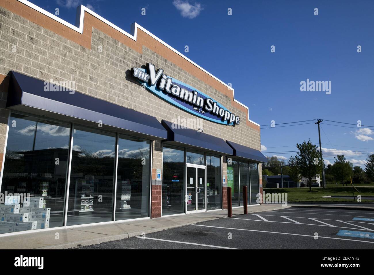 A logo sign outside of a The Vitamin Shoppe retail store location in ...