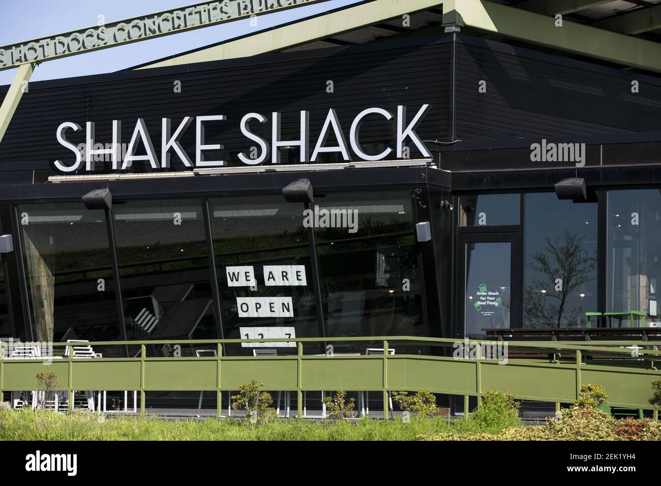 A logo sign outside of a Shake Shack restaurant location in King of ...