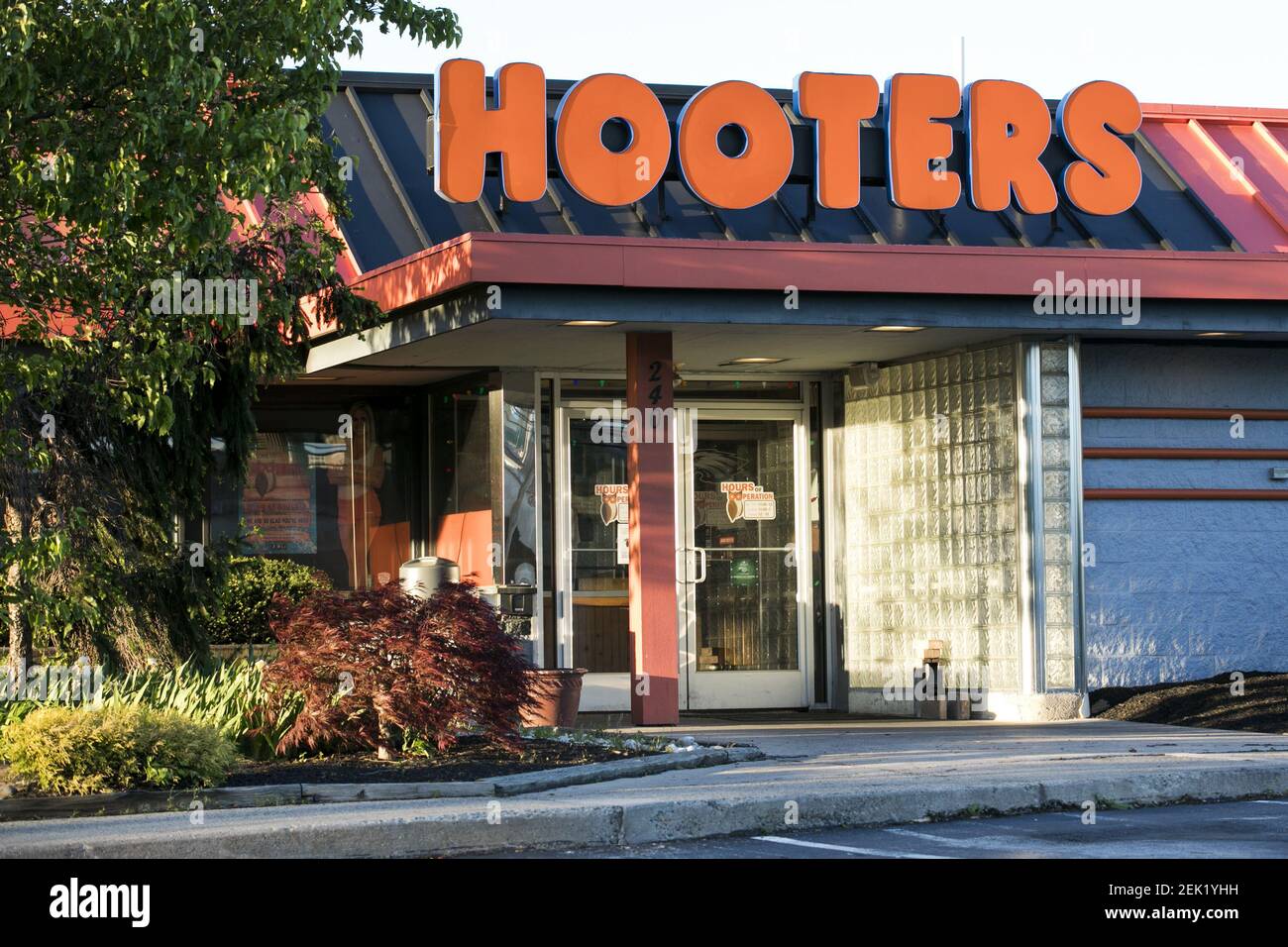 A logo sign outside of a Hooters restaurant location in King of Prussia ...