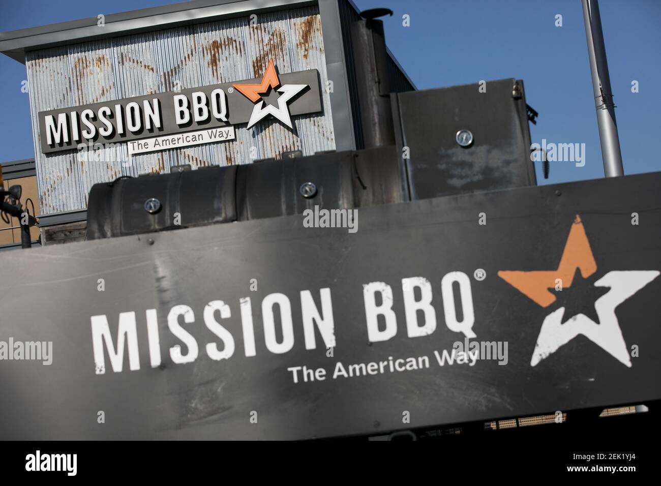 A logo sign outside of a Mission BBQ restaurant location in King of ...