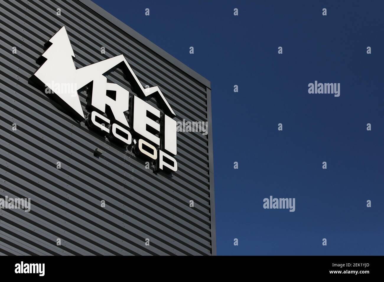 A logo sign outside of a Recreational Equipment, Inc., (REI) retail ...
