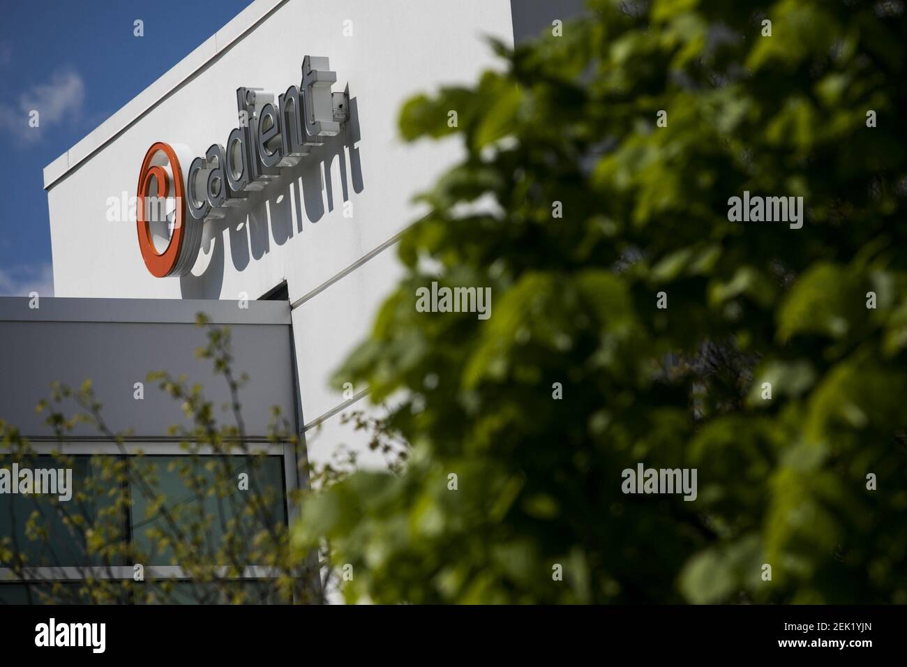 A logo sign outside of a facility occupied by Cadient Group in Malvern ...
