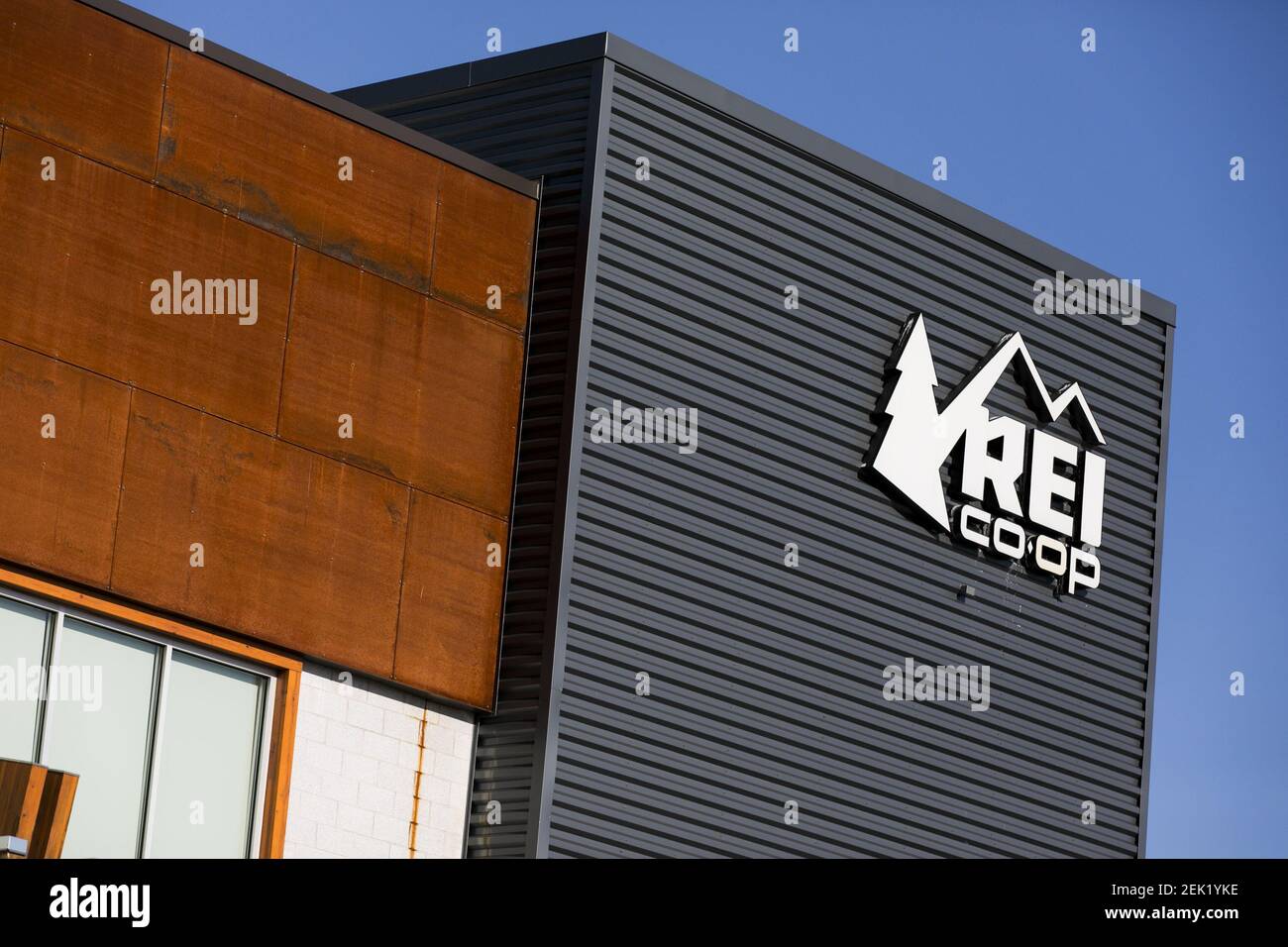 A logo sign outside of a Recreational Equipment, Inc., (REI) retail ...
