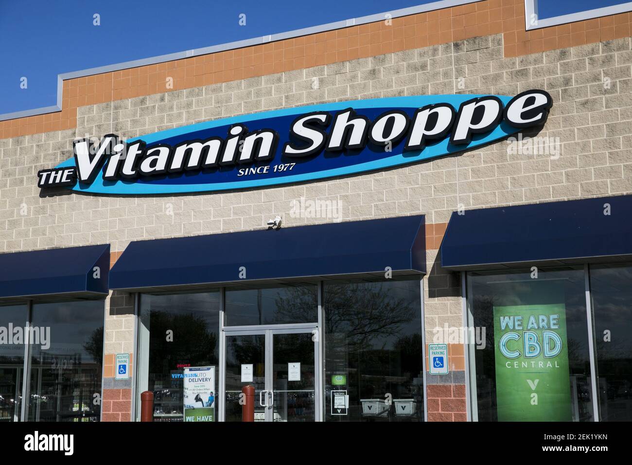 A logo sign outside of a The Vitamin Shoppe retail store location in ...