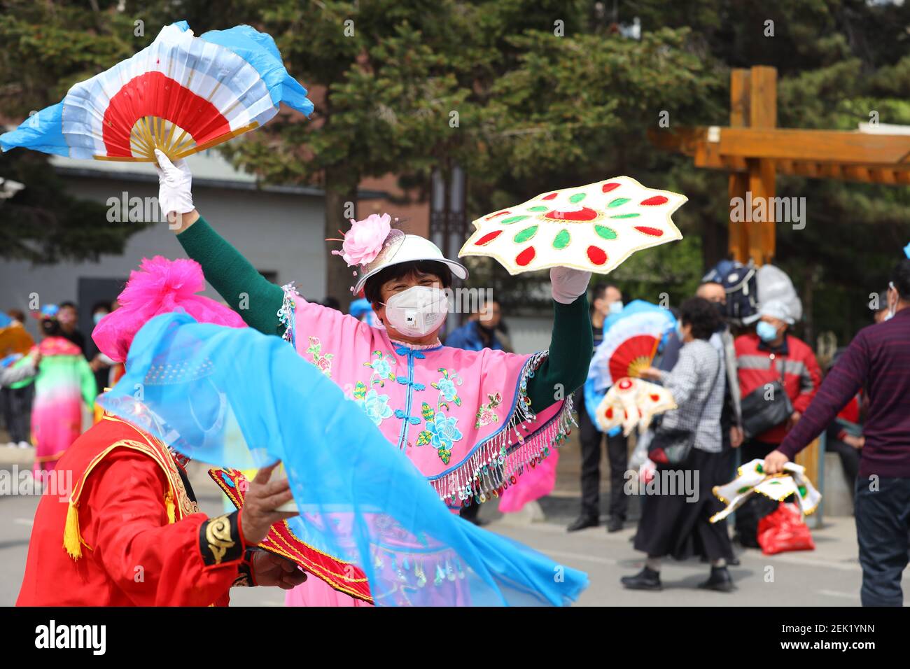 People dressed in traditional Chinese costume do yangko dance, a ...