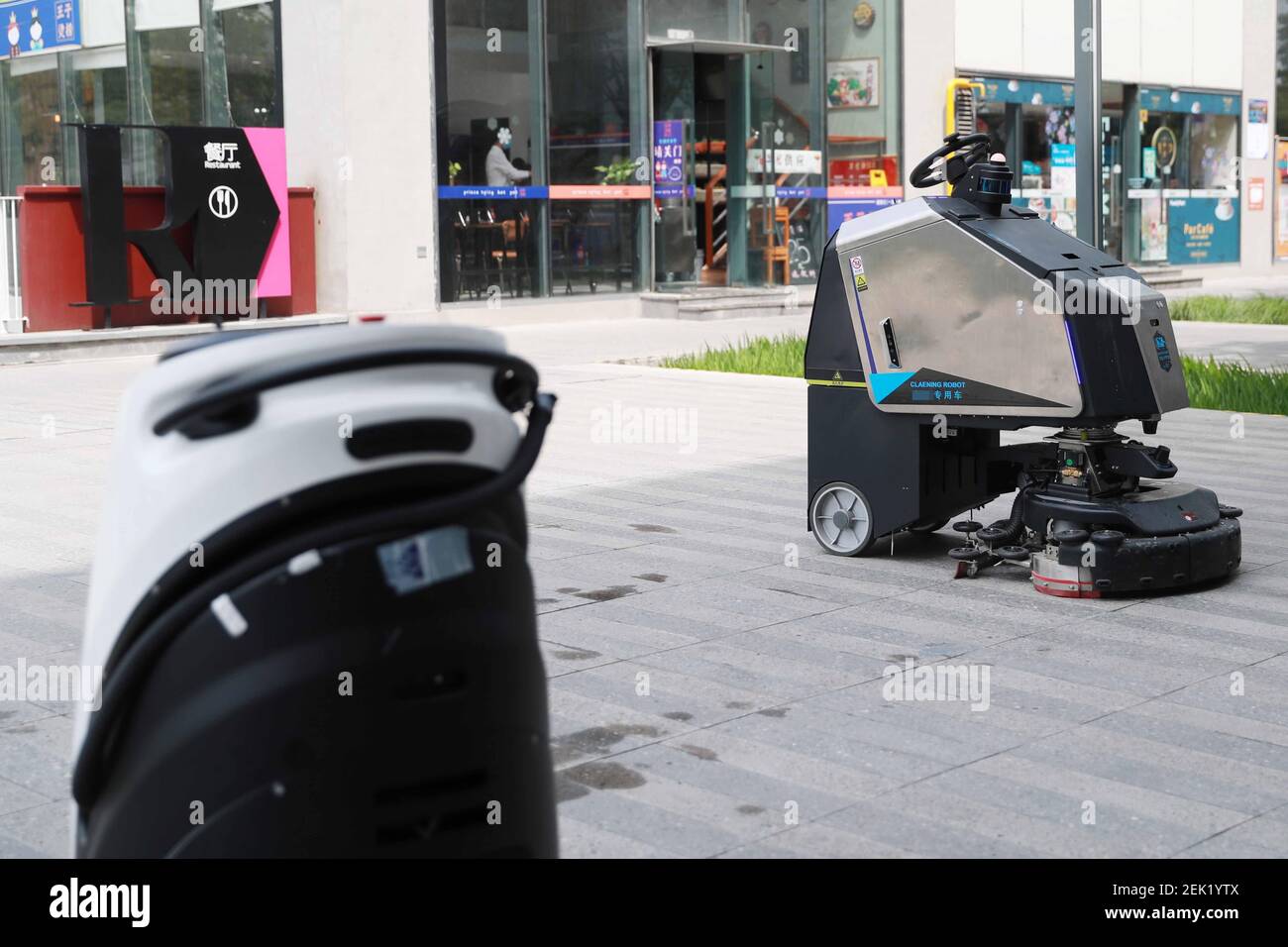 Two cleaning robots from Gaussian Robotics work under the headquarter ...