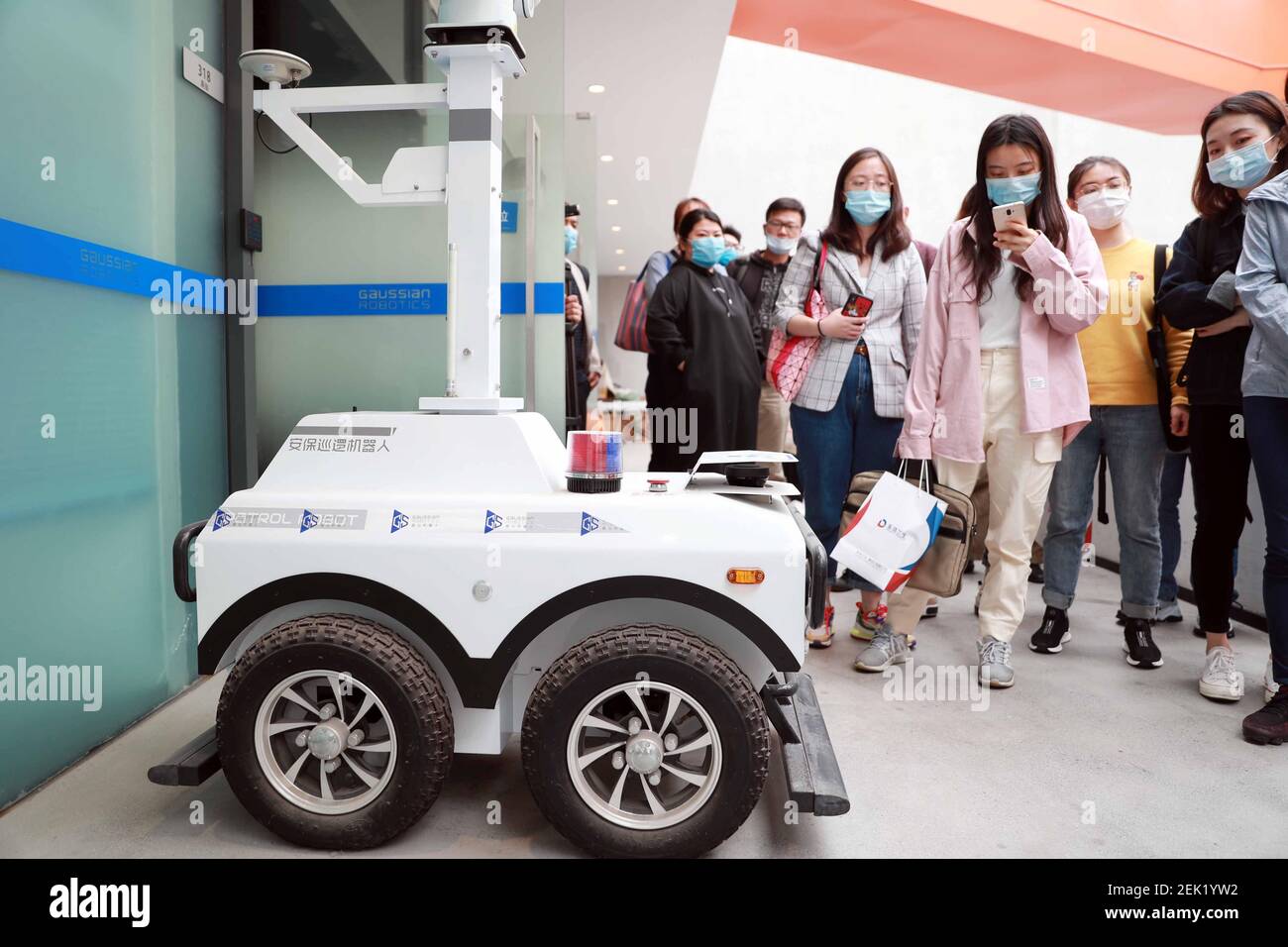 People take pictures of the cleaning robots from Gaussian Robotics ...