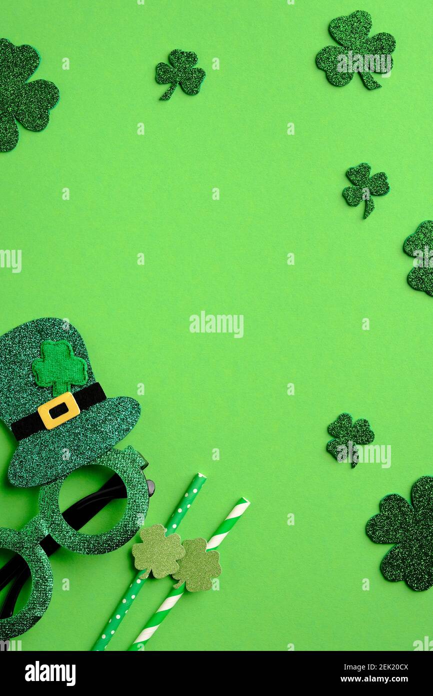 St Patricks day vertical banner design. Top view shamrock four leaf ...